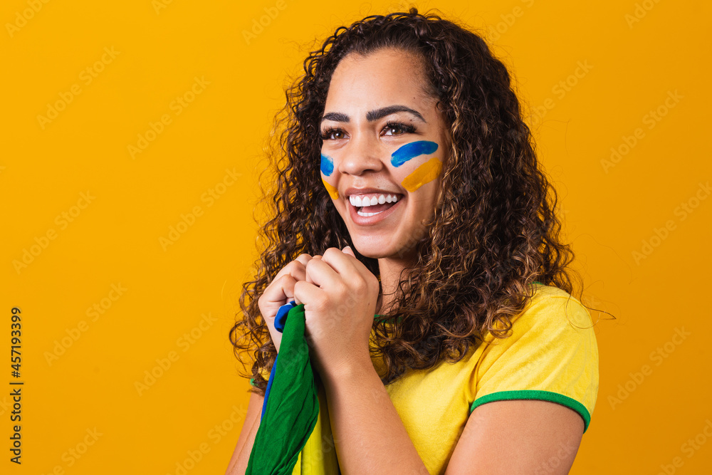 brazilian fan with her face painted in blue and yellow for the brazil ...