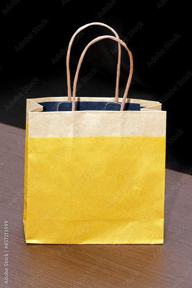 Yellow cardboard bag Stock Photo | Adobe Stock