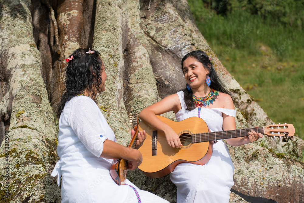 Indigenous women with a musical instrument. new era of the indigenous ...
