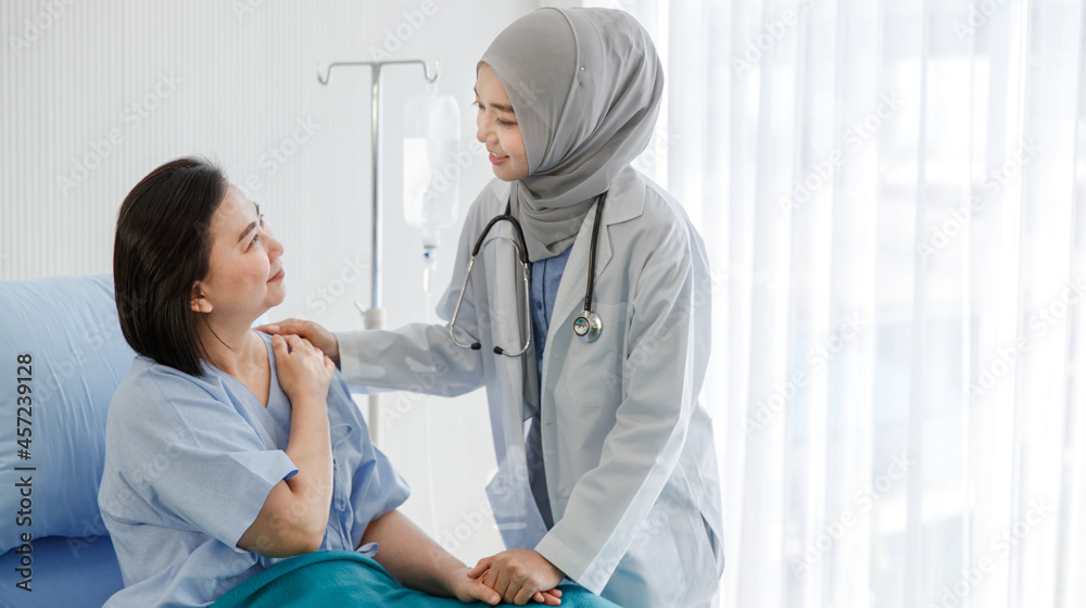 Muslim Arab Islam female doctor wears grey hijab and white lab coat ...