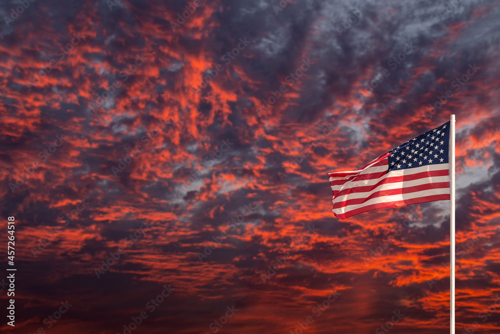 Waving flag of United States of America against dramatic red blood ...
