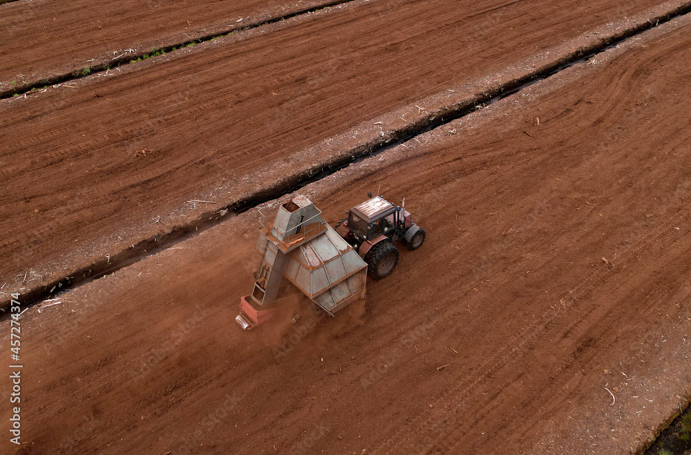 Peat Harvester Tractor on Collecting Extracting Peat. Mining and ...
