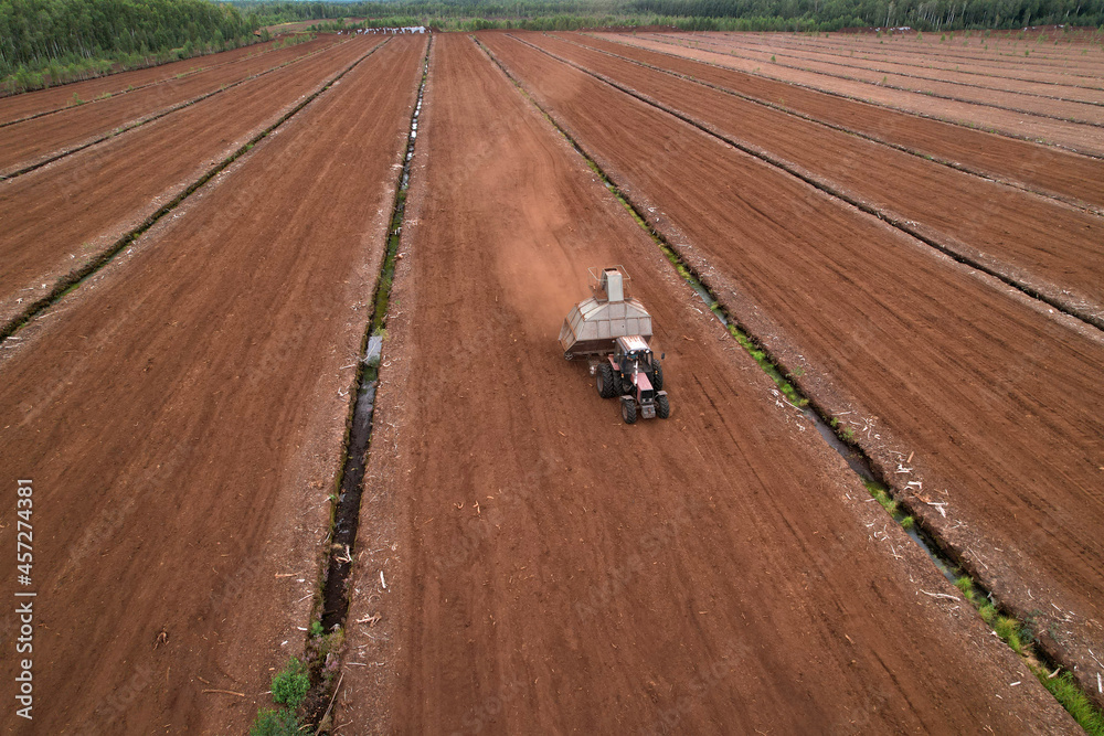 Peat Harvester Tractor on Collecting Extracting Peat. Mining and ...