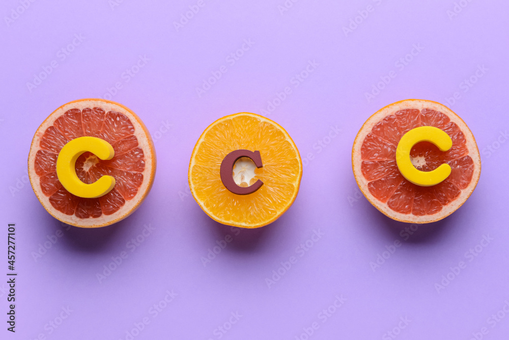 Letters C and cut citrus fruits on color background Stock Photo | Adobe ...
