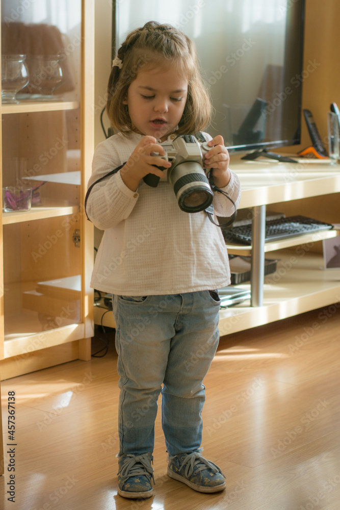 Child Taking A Picture. A Child Pretending To Take A Photograph With A ...