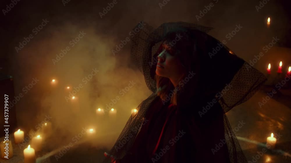 Witch woman sitting in pentagram circle and reading spell. Evil ...