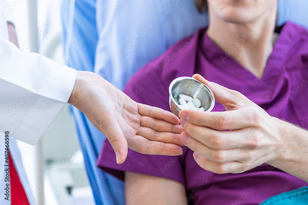 Close-up of Female doctor therapeutic advising Give Different tablets ...