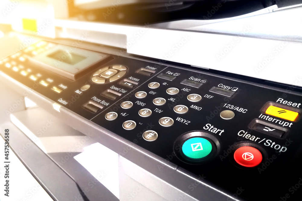 Shot of printer control panel contains many buttons such as start, stop ...