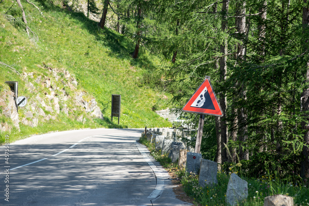 Road sign falling stones. Traffic sign caution possible falling rocks ...
