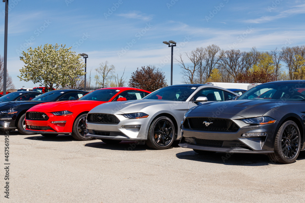 Ford Mustang display at a dealership. Ford offers the Mustang in a base ...