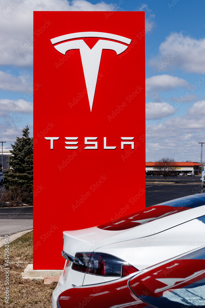 Tesla electric vehicles awaiting preparation for sale. Tesla EV Model 3 ...