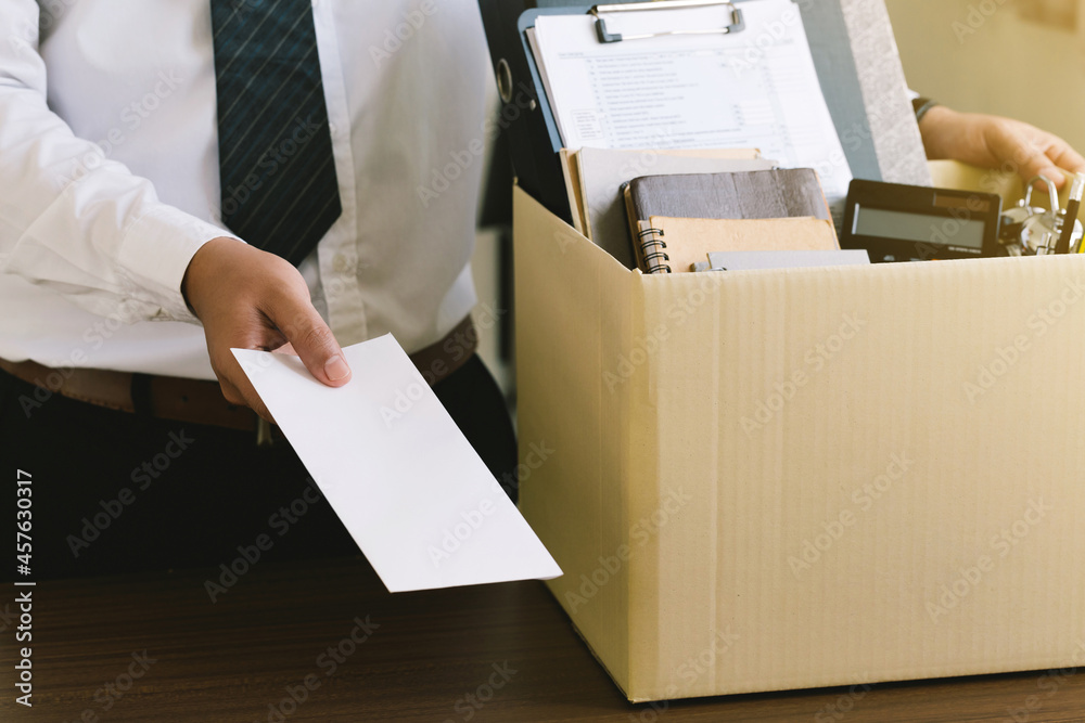 Resignation.Businessman sending letter of resignation to the executive ...