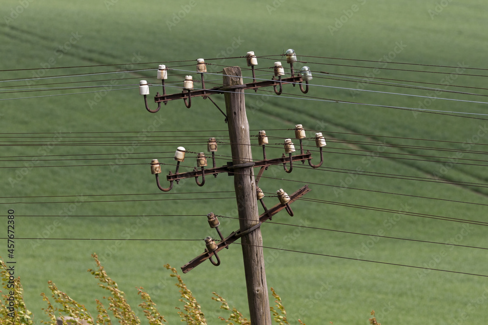 Vintage wooden electric pole, ceramic power insulators, porcelain ...