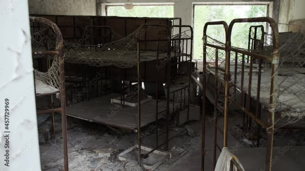 Bunk beds inside an abandoned kindergarten in Pripyat ghost town. Old ...