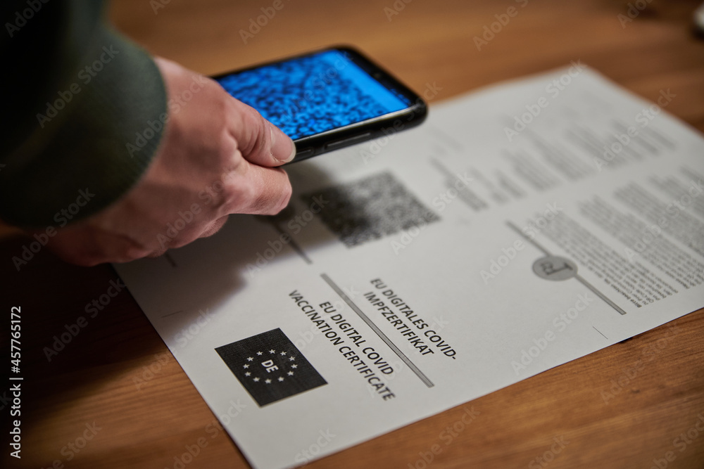 Person scanning the QR code of a covid 19 certificate. Scanning the ...