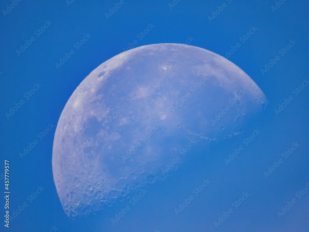 Daytime Moon: The moon appears in the daytime blue sky on a summer day ...