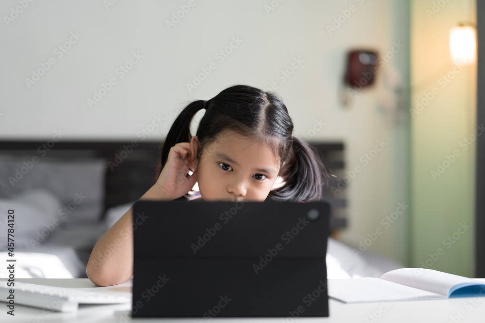 asian child back to school or kid girl learning and read on computer ...