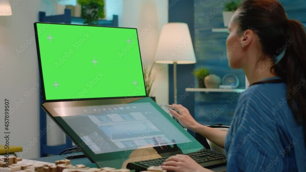 Woman architect using green screen for building model and architectural ...