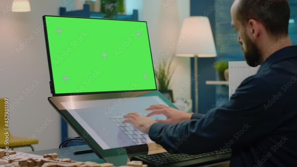 Man architect with green screen analyzing building model on touch ...