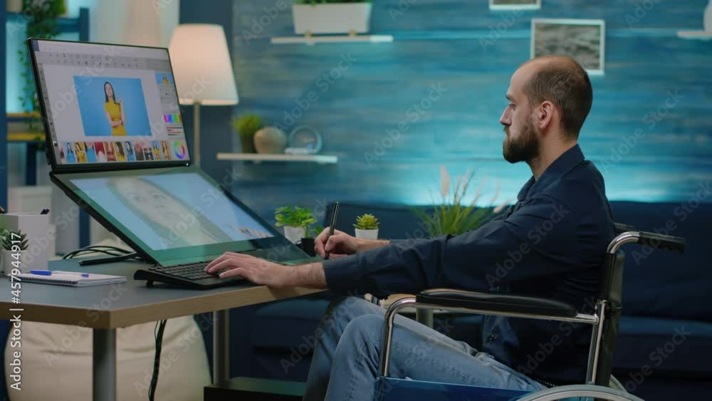 Invalid artist using retouching software and graphic tablet to edit ...