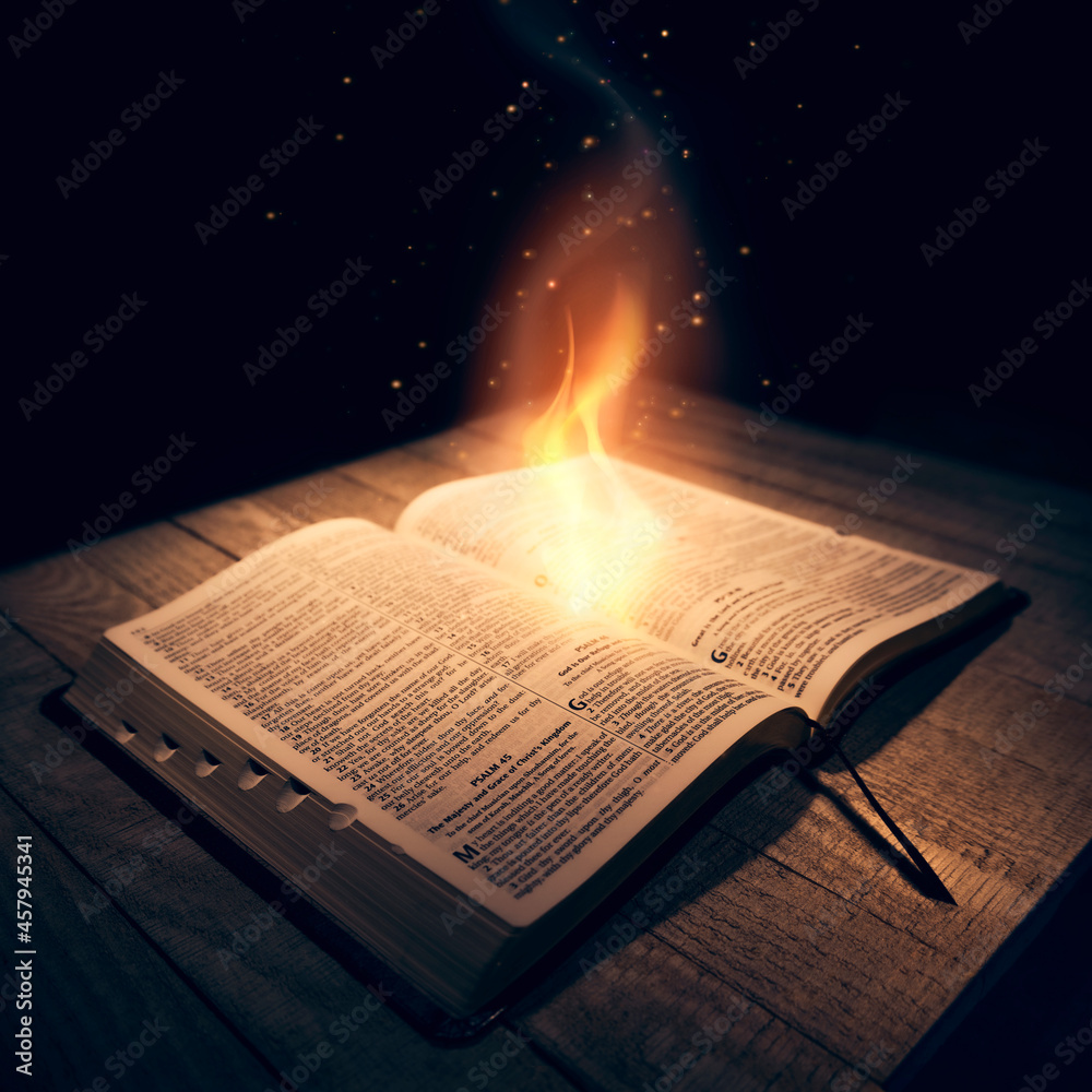 Flame coming out of the Holy Bible. Stock Photo | Adobe Stock