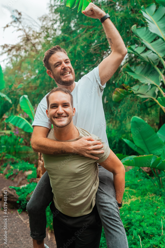 gay couple piggyback ride Stock Photo | Adobe Stock
