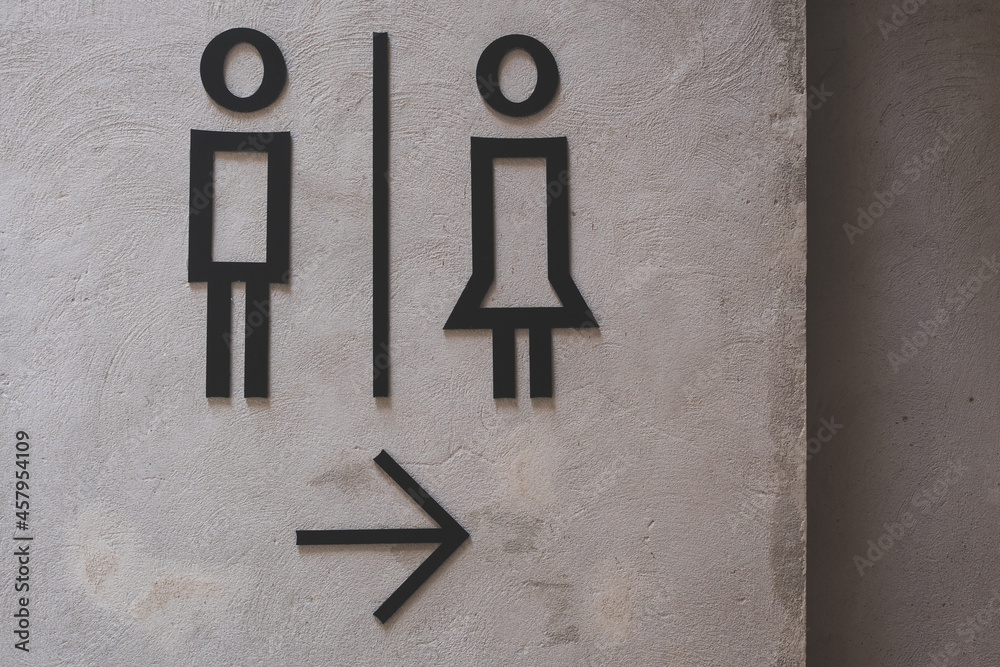 Modern men and women public toilet or restroom sign with right ...