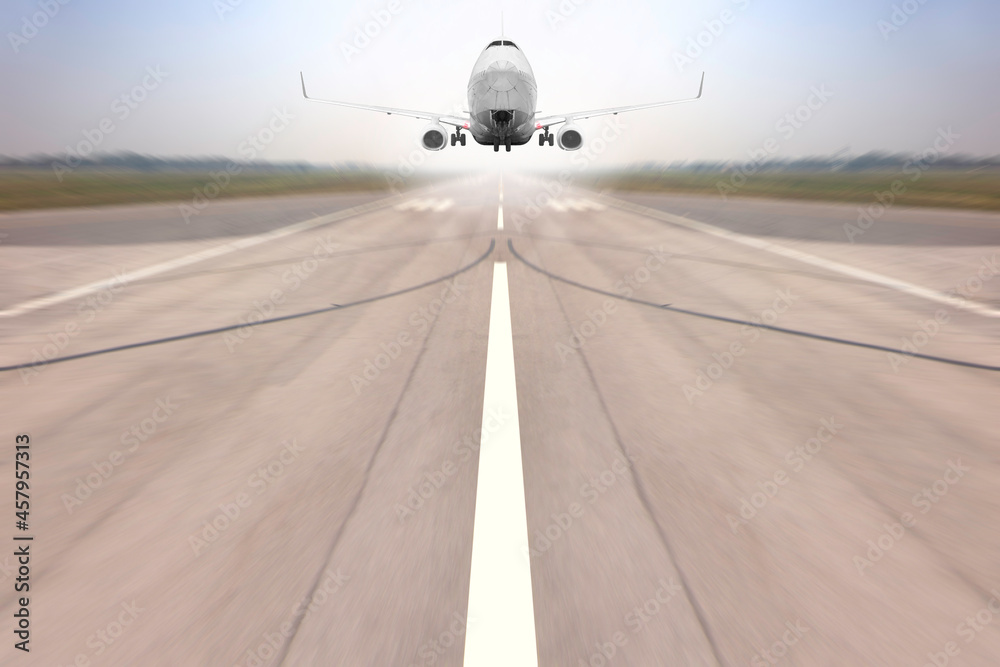 Airplane landing on the runway and landing lights on the tarmac of ...