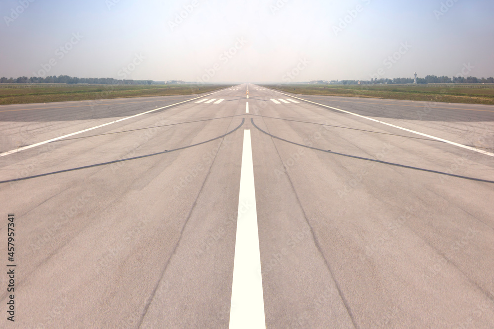 Runway sign markings and landing lights on the tarmac of runway at a ...