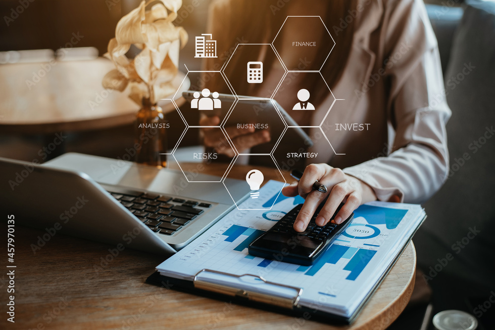 Accounting Financial and tax systems concept. Businessmen are calculating income-expenditure and ...