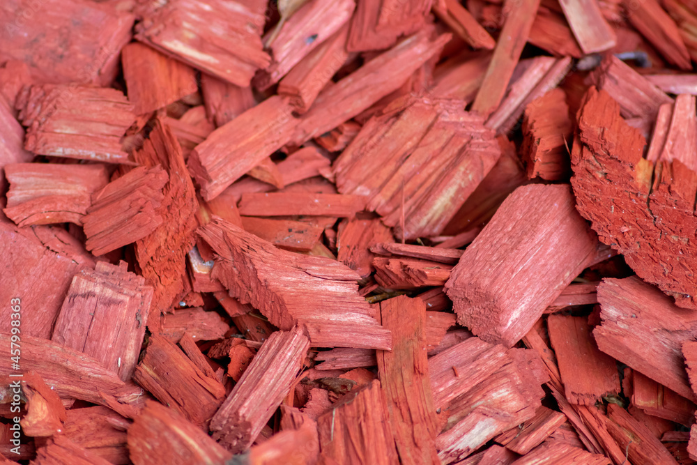 Shredded red wood chips fragments as red woodpath with timber shavings ...