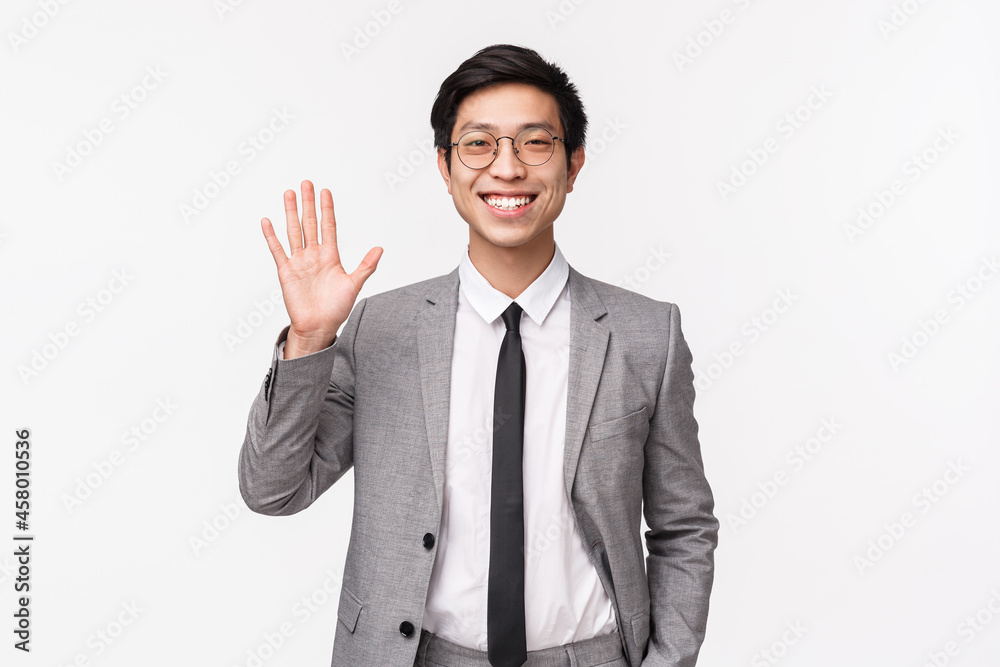 Waist-up portrait of friendly, cheerful smiling asian male entrepreneur ...