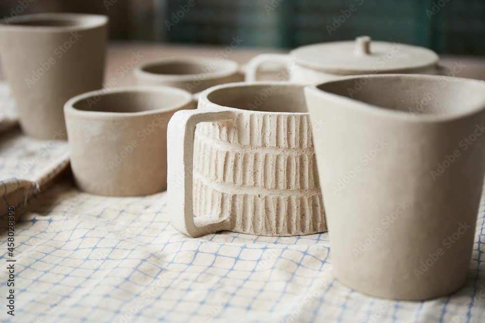 Working table of a ceramist. Clay workshop. The process of creating ...