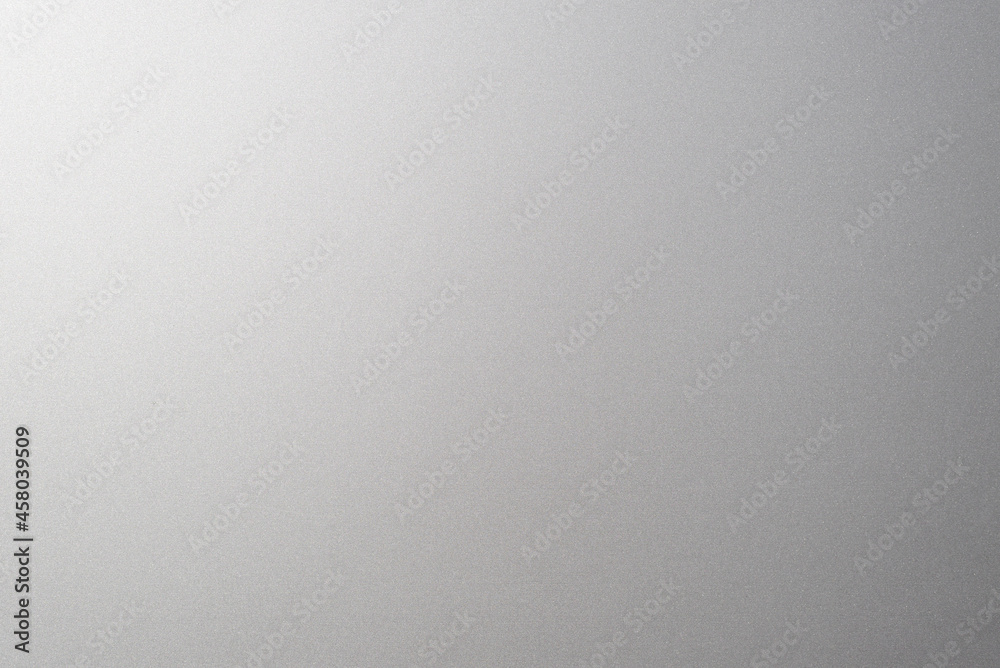 Matte gray smooth plastic surface with fine texture and vignette on the ...