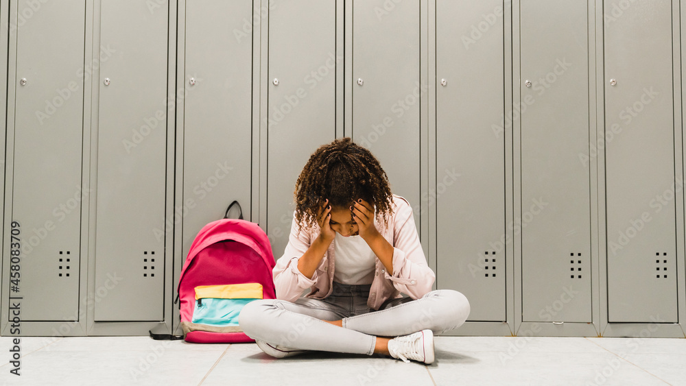 Foto de Troubles at school. Lonely sad african-american schoolgirl ...