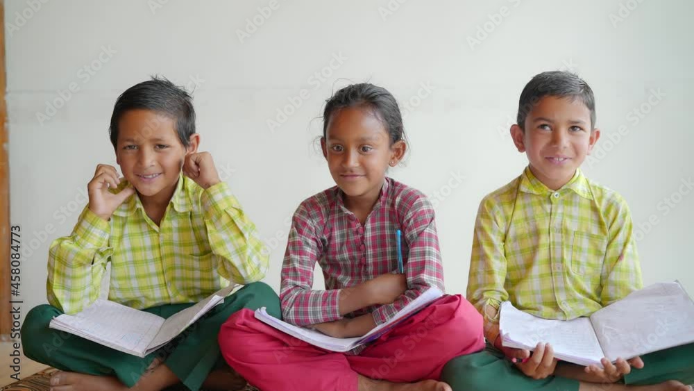 shot of trio indian asian primary school children wearing uniforms ...
