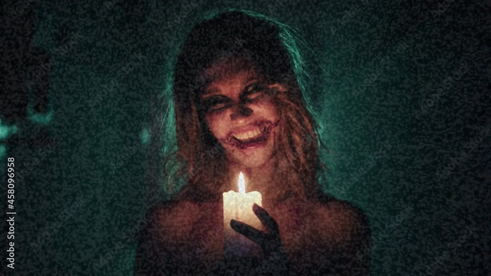 Old tv screen showing zombie woman holding burning candle close-up ...
