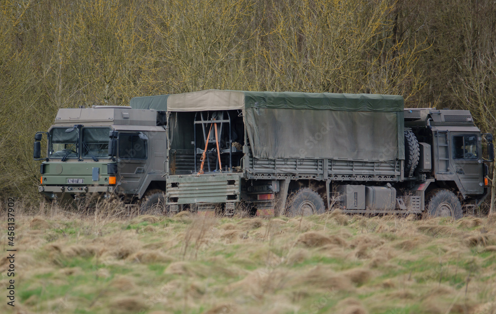 two army logistics lorry vehicle trucks parked whilst on a military ...