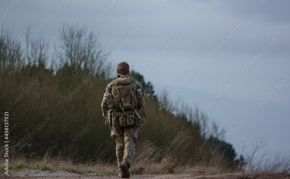 British army soldier completing an 8 mile tabbing exercise with fully ...