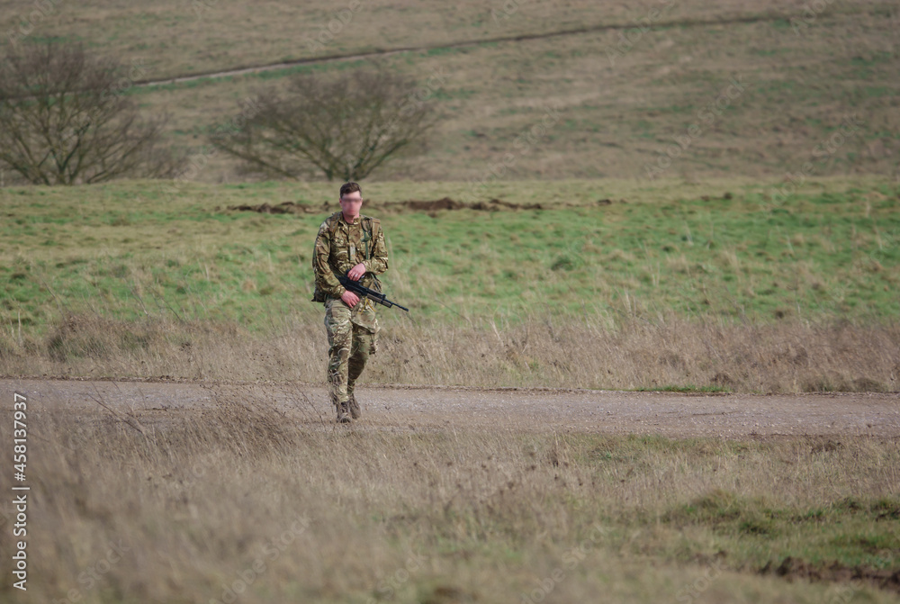 British army soldier completing an 8 mile tabbing exercise with fully ...