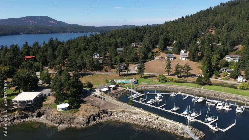 Cinematic 4K aerial rise and reverse drone clip of Rosario Point, Cascade Bay, East Sound ...