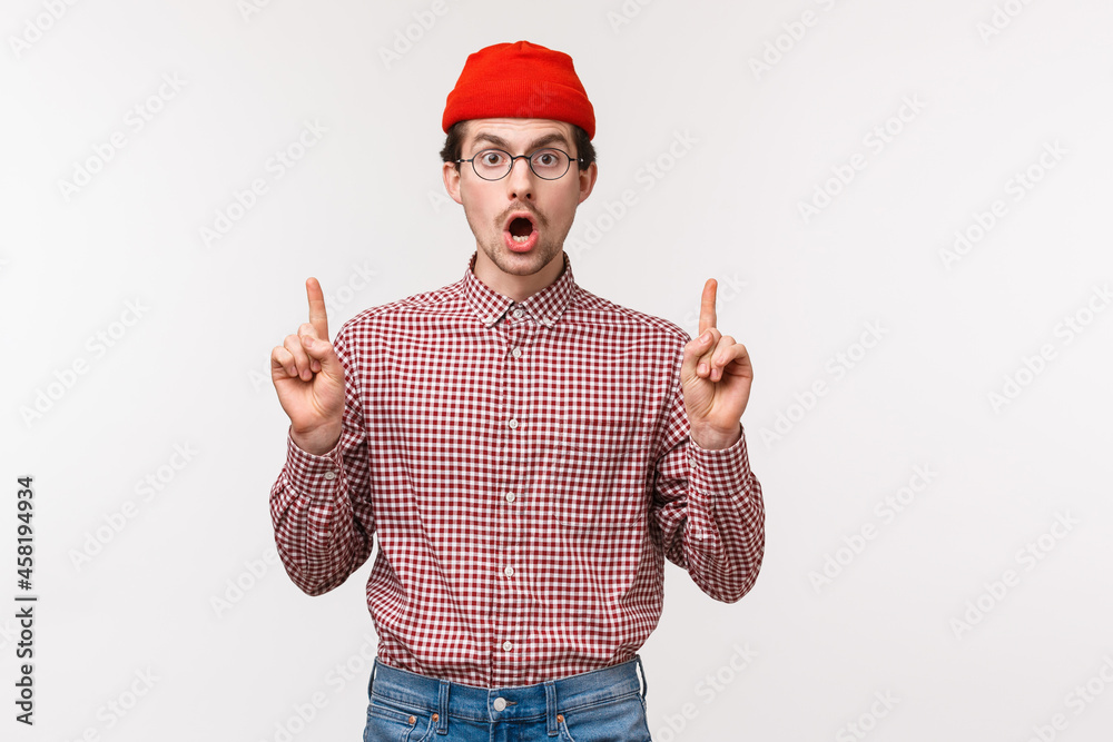 Waist-up portrait surprised and excited handsome guy staring at camera ...