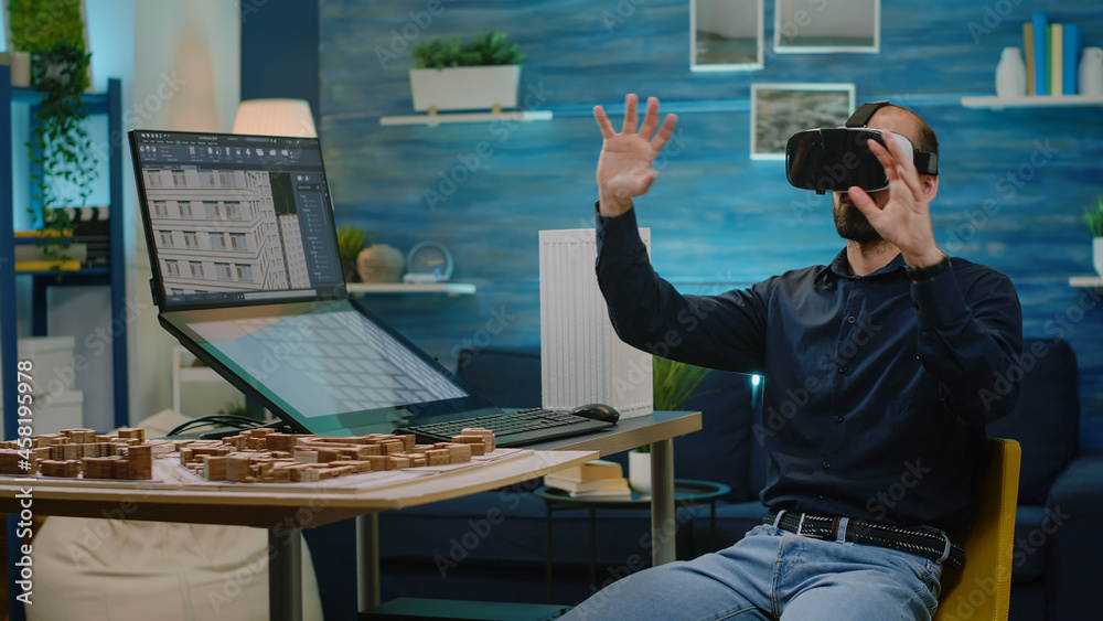Architect using vr glasses for building model design in architectural ...
