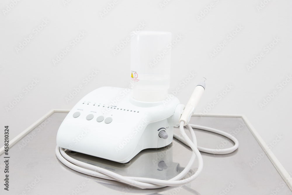 Ultrasound device for brushing teeth, close-up on the dentist's desk ...