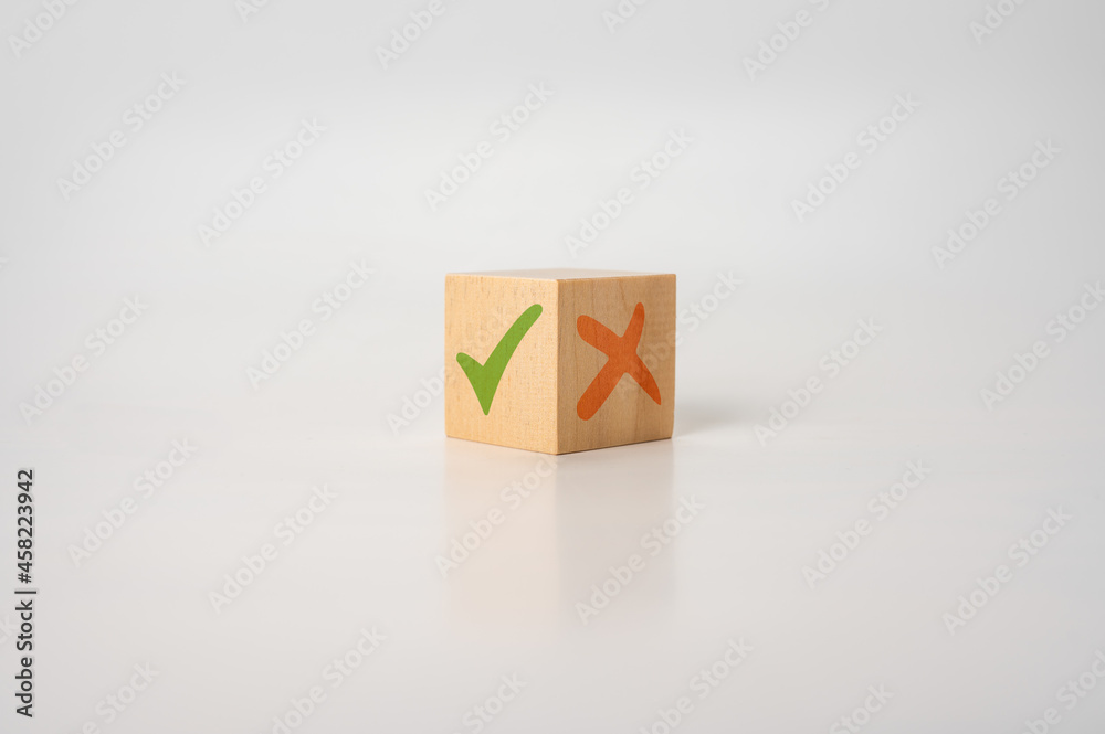 Tick mark and cross mark x on wooden cubes. Wooden blocks with green ...