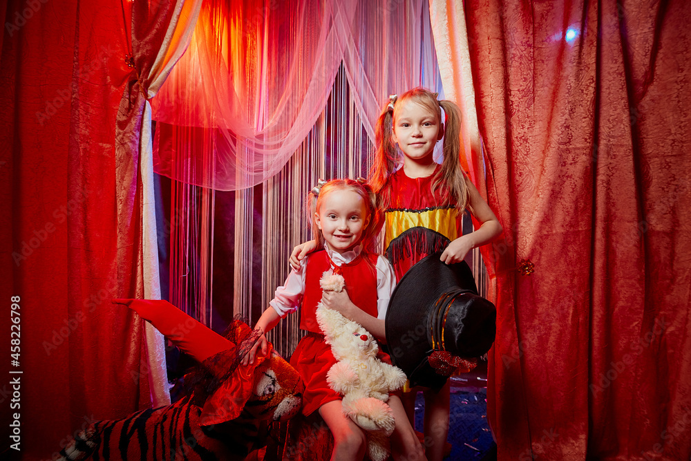 Small girls during a stylized theatrical circus photo shoot in a ...