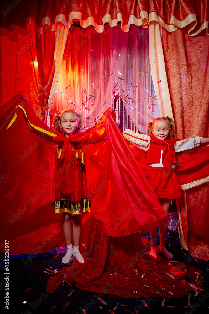 Small girls during a stylized theatrical circus photo shoot in a ...