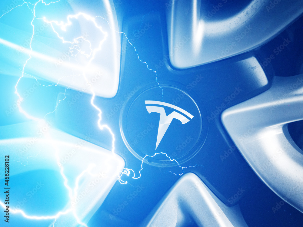 Tesla logo on Tesla Model 3 rim, multiple exposure combined with power ...