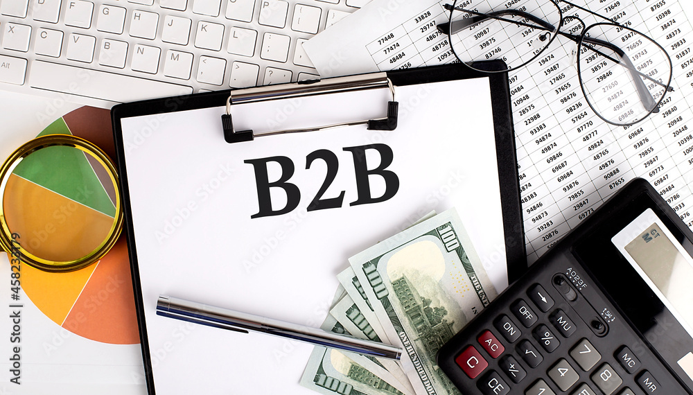 Text B2B on Office desk table with keyboard,dollars,calculator ...