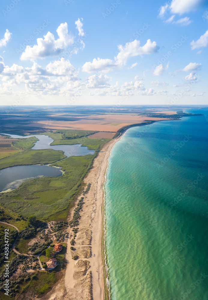 Aerial view of beautiful empty wild beach with turquoise sea waters and ...